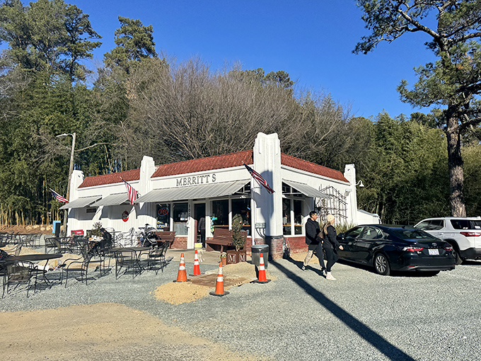 The unassuming white building with American flags proudly waving says it all: great food doesn't need fancy architecture, just perfect execution.
