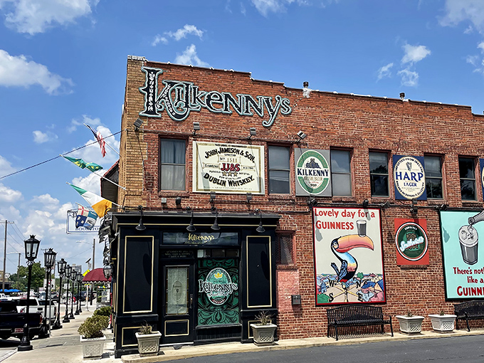 The brick facade of Kilkenny's stands proudly on Cherry Street, its vintage Guinness murals and emerald signage promising authentic Irish comfort in the heart of Tulsa.