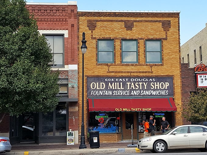The yellow-brick storefront with its vintage red awning isn't just preserving history&mdash;it's practically a time portal to 1932 Wichita with better sandwiches.