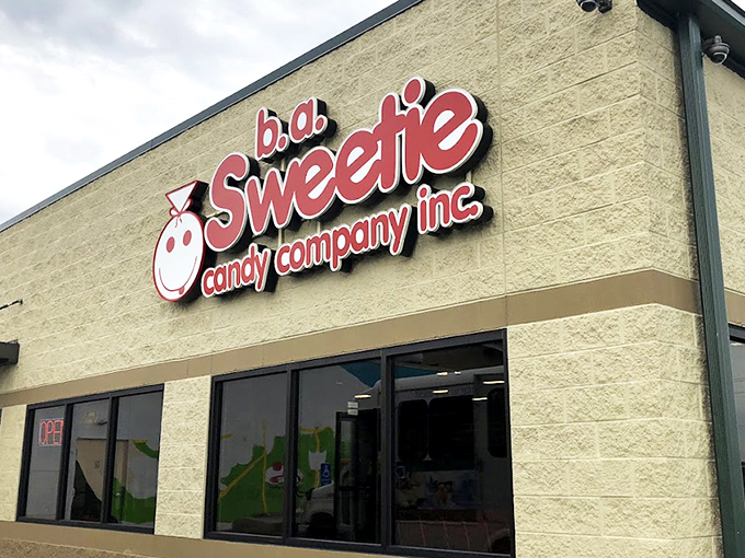 That iconic red signage against the cream-colored building is like a beacon for your inner child. Sweeties Candy Company stands ready to fulfill sugar-coated dreams.