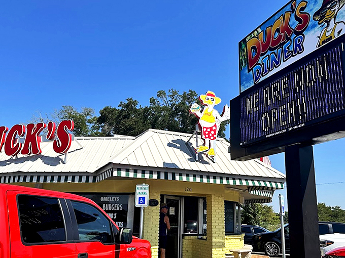 The bright red "DUCK'S" sign stands out like a breakfast lighthouse, guiding hungry souls to this Gulf Shores sanctuary of morning delights.