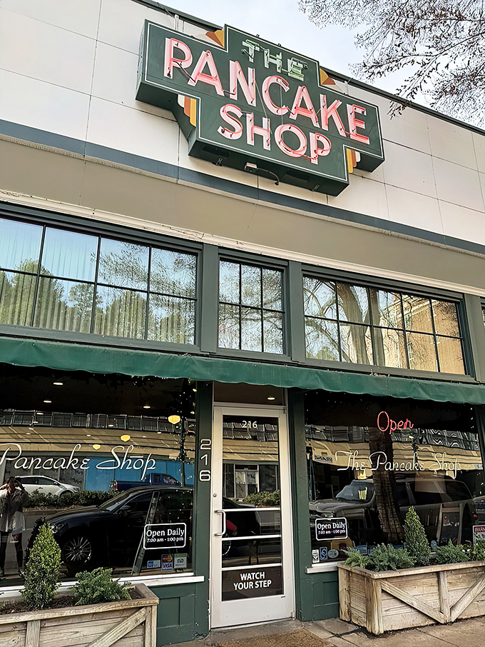 The iconic green sign beckons like a breakfast lighthouse on Central Avenue, promising pancake paradise to early risers and brunch enthusiasts alike.