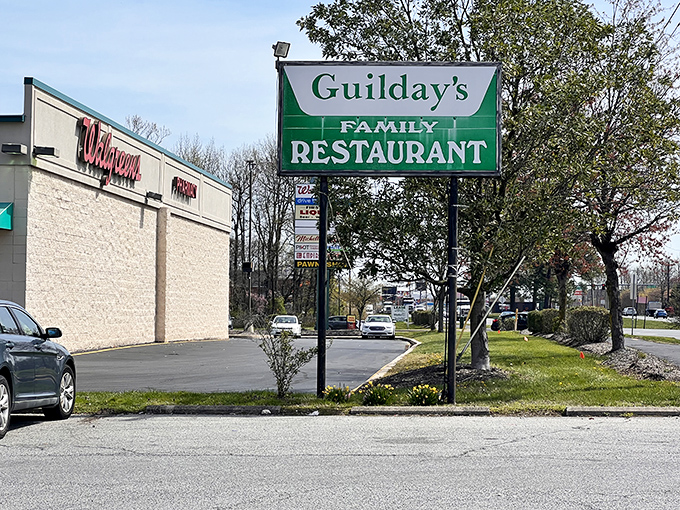 The unassuming exterior of Guilday's stands like a breakfast beacon in Newark, promising pancake perfection behind its humble white walls.