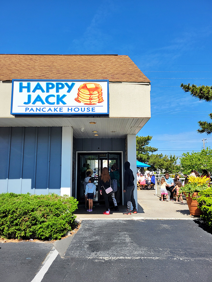 The iconic blue and orange sign beckons hungry beachgoers with its promise of pancake perfection and the bonus of dad jokes that are so bad they're good.