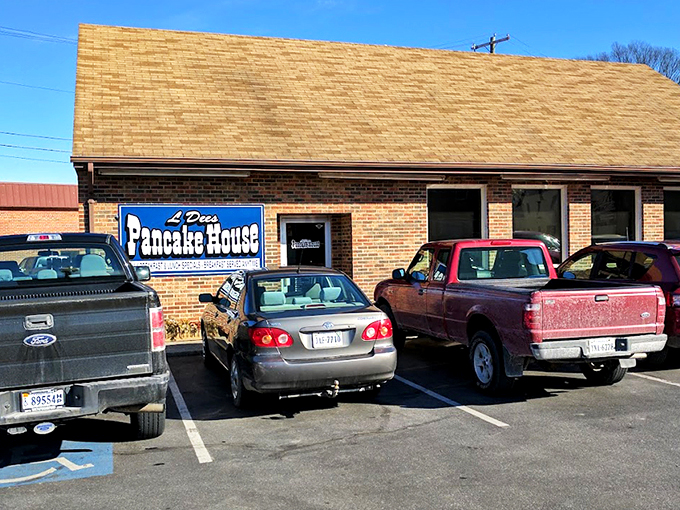 The unassuming brick exterior of L'Dees Pancake House &ndash; where breakfast dreams come true without any architectural showboating. Simple sign, serious pancakes.