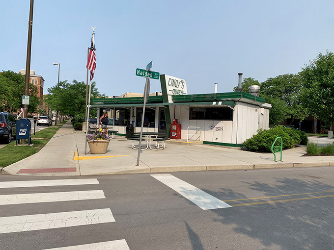 The classic green and white exterior of Cindy's Diner stands proudly in downtown Fort Wayne, promising breakfast magic with its vintage charm.