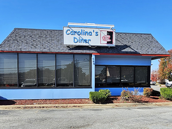 The distinctive blue exterior of Carolina's Diner stands as a beacon of breakfast hope along Regional Road, promising comfort food salvation inside. 