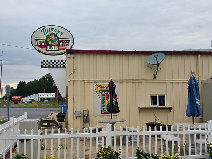 Classic Americana gleams in the rain at Nancy's Main Street Diner, where that stainless steel exterior promises comfort food treasures await inside.