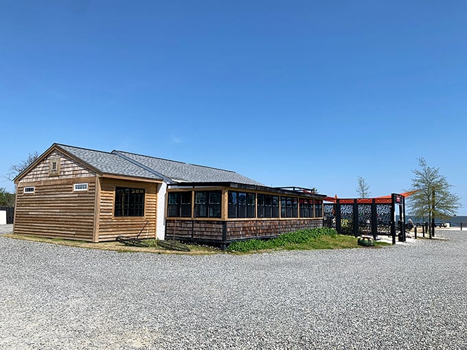 The entrance to seafood paradise - a humble wooden structure with bright orange awnings where Chesapeake Bay magic happens daily.