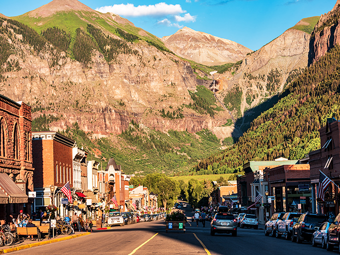 Colorado Avenue stretches toward mountain majesty, where Victorian charm meets alpine grandeur. Telluride's main street invites you to wander and wonder.