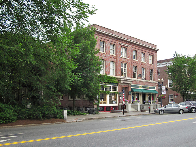 Hanover's Main Street beckons with its classic New England charm. Red brick buildings and colorful awnings create the perfect small-town backdrop for your spring adventure.