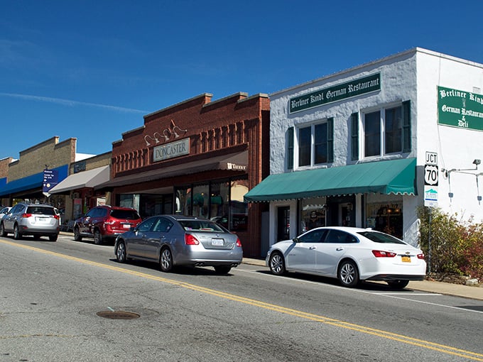 Downtown Black Mountain welcomes visitors with its classic small-town charm, where brick buildings frame picture-perfect mountain views in the distance.