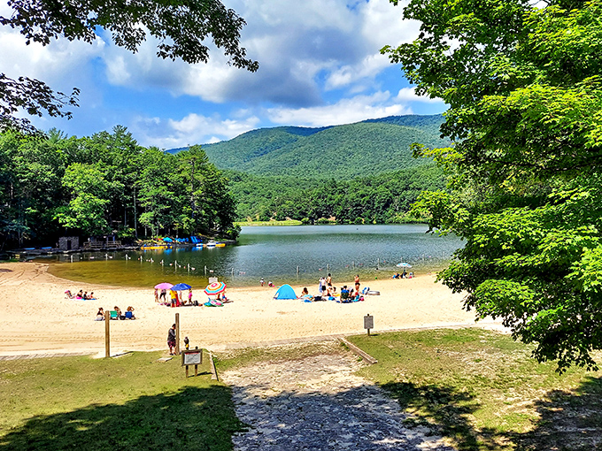 Mother Nature's beach day perfection: crystal-clear mountain water meets sandy shores, all framed by the Allegheny Mountains' emerald embrace.