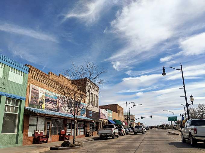 The famous corner in Winslow, Arizona, complete with Route 66 shield painted right on the pavement. Rock and roll geography at its finest!