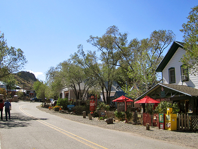 Madrid's main street welcomes you with colorful storefronts and that unmistakable small-town charm. Like stepping into a Wes Anderson film set in the high desert.