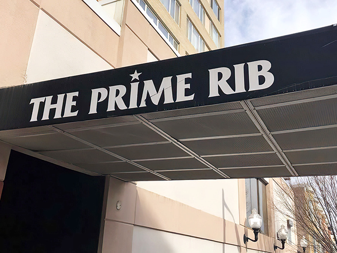 The understated elegance of The Prime Rib's entrance promises what lies beyond&mdash;a Baltimore dining institution where time stands deliciously still.