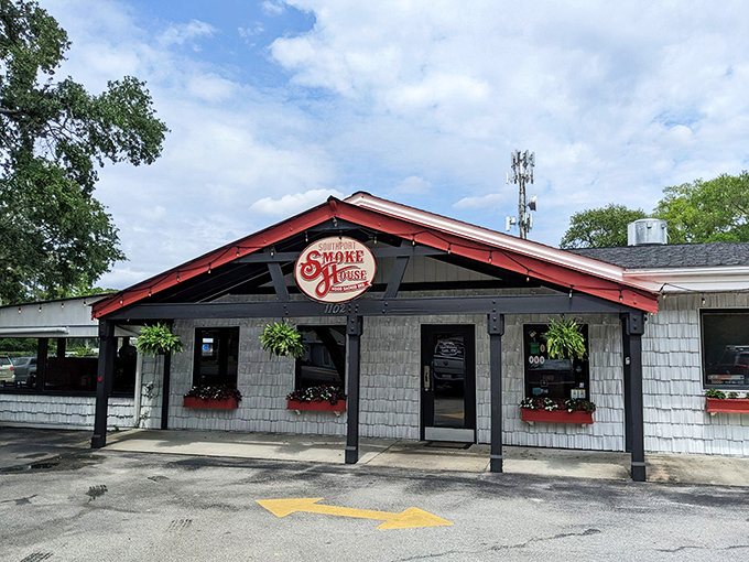 The red-roofed temple of smoke beckons with all the subtlety of a dinner bell, promising salvation through slow-cooked meats in coastal Southport.