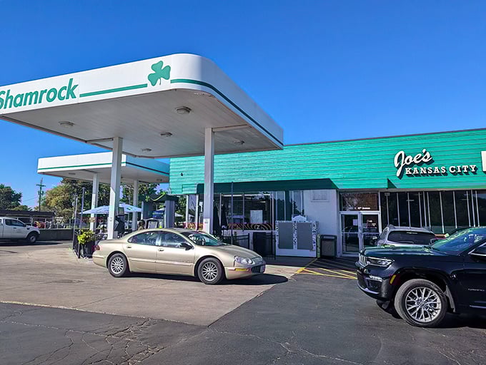 The emerald beacon of barbecue bliss! Joe's iconic green exterior stands as Kansas City's tastiest gas station conversion, promising smoky treasures within.