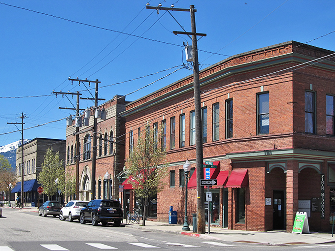 Historic brick buildings stand sentinel along Sandpoint's main street, where small-town charm meets mountain views that could make a postcard jealous.