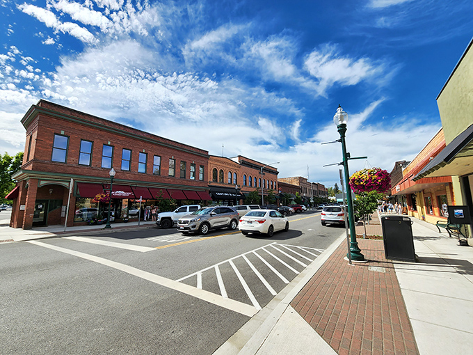 Historic brick buildings stand sentinel along Sandpoint's main street, where small-town charm meets mountain views that could make a postcard jealous.