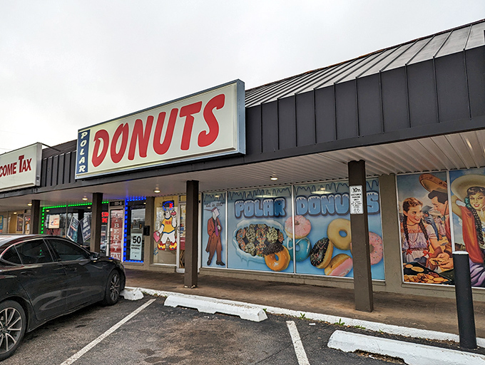 The blue and red signage beckons like a sugar-coated lighthouse. Polar Donuts' storefront promises sweet adventures within those frosty-themed walls.