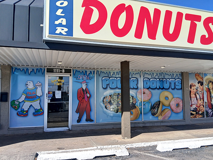 The blue and red signage beckons like a sugar-coated lighthouse. Polar Donuts' storefront promises sweet adventures within those frosty-themed walls.