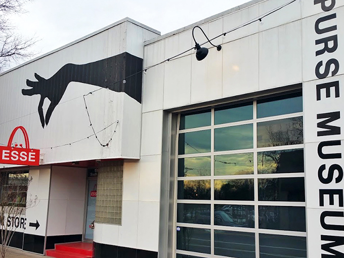 The striking exterior features a giant hand clutching a red purse&mdash;like King Kong if he'd had better fashion sense.