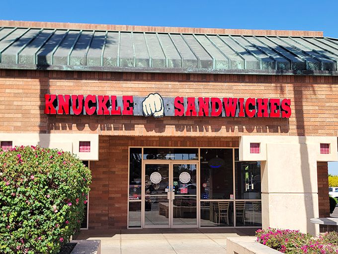 The "NOW OPEN!" banner might be outdated, but the promise of what awaits behind those brick walls is eternally fresh. A sandwich sanctuary beckons.