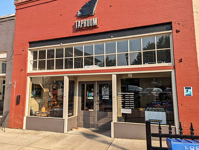 The vibrant red brick exterior of Old Black Bear Brewing Company stands as Madison's beacon for craft beer enthusiasts and root beer pilgrims alike.