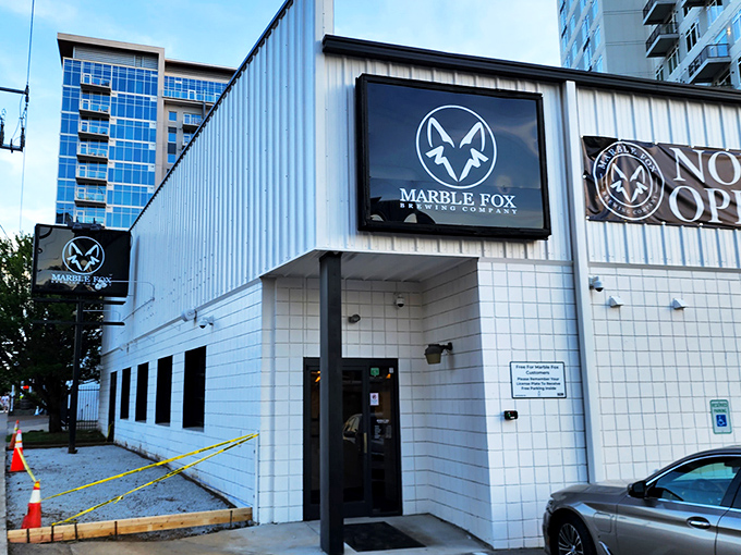 The unassuming white exterior of Marble Fox Brewing Company stands like a blank canvas, hiding the flavor explosion waiting inside. Nashville's best-kept liquid secret.