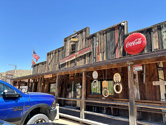 The weathered wooden facade of Tortilla Flat Saloon stands defiantly against time, a slice of the Wild West complete with authentic frontier charm and a Coca-Cola sign that's seen it all.