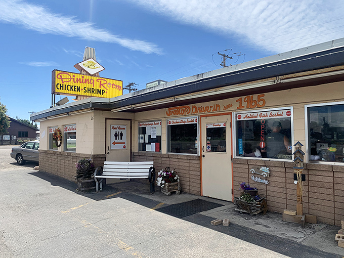 The time-capsule exterior of Frostop Drive In beckons with its vintage signage and welcoming bench&mdash;a portal to simpler, more delicious times.