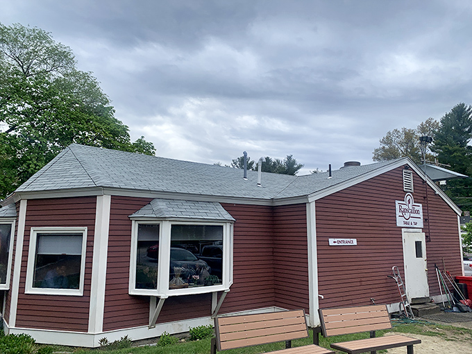 The unassuming burgundy exterior of Rapscallion Table & Tap holds culinary treasures that belie its modest appearance, like finding a Michelin star in a phone booth.
