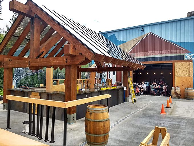 The timber-framed outdoor seating area beckons like an old friend, promising cold brews and mountain views that'll make your city stress evaporate instantly.