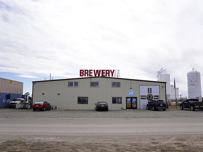 The ultimate "don't judge a book by its cover" moment. This unassuming metal building houses liquid gold under that brilliant New Mexico sky.