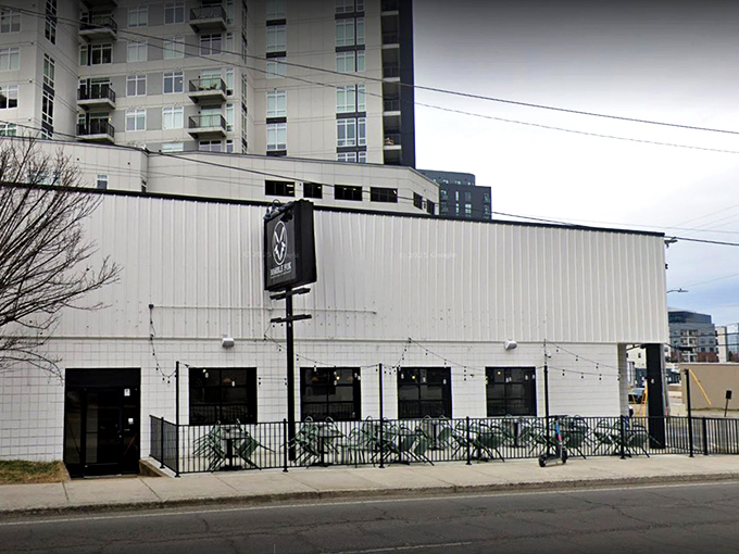 The unassuming white exterior of Marble Fox Brewing Company stands like a blank canvas, hiding the flavor explosion waiting inside. Nashville's best-kept liquid secret.