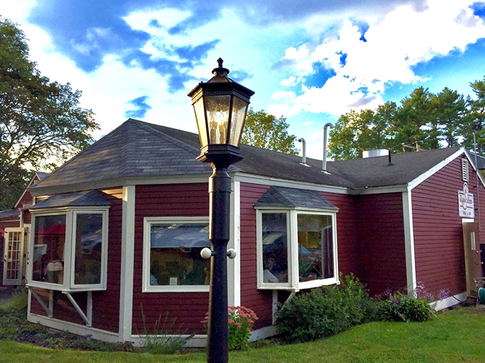 The unassuming burgundy exterior of Rapscallion Table & Tap holds culinary treasures that belie its modest appearance, like finding a Michelin star in a phone booth. 