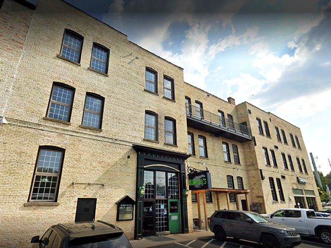 The historic brick façade of North Peak Brewing Company stands proud on Front Street, a Traverse City landmark that's been reinvented as a temple to craft beverages and comfort food.