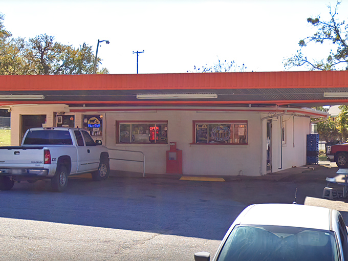 The unassuming exterior of K N Root Beer Drive In proves once again that Texas's greatest culinary treasures often hide in plain sight.