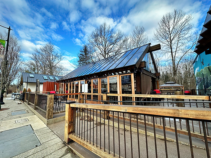 The timber-framed outdoor seating area beckons like an old friend, promising cold brews and mountain views that'll make your city stress evaporate instantly.