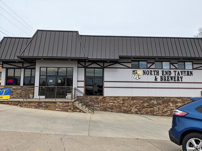 The Tudor-style exterior of North End Tavern & Brewery stands as a welcoming beacon for hungry travelers and thirsty locals alike.