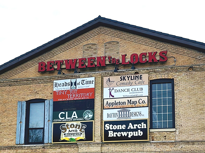 Stone Arch Brewpub's historic brick exterior with blue shutters stands as Appleton's answer to "where should we eat tonight?" Timeless charm meets modern craft brewing.