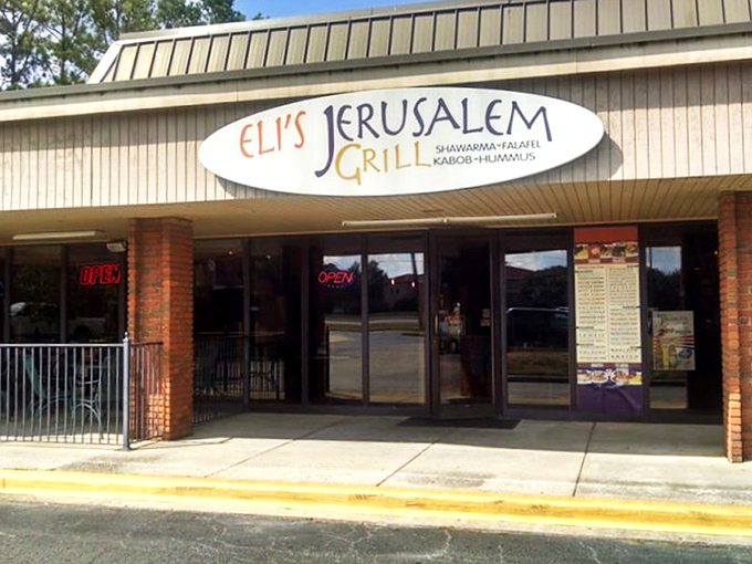 The unassuming storefront of Eli's Jerusalem Grill belies the culinary treasures waiting inside. Sometimes the best global cuisine hides in plain sight.