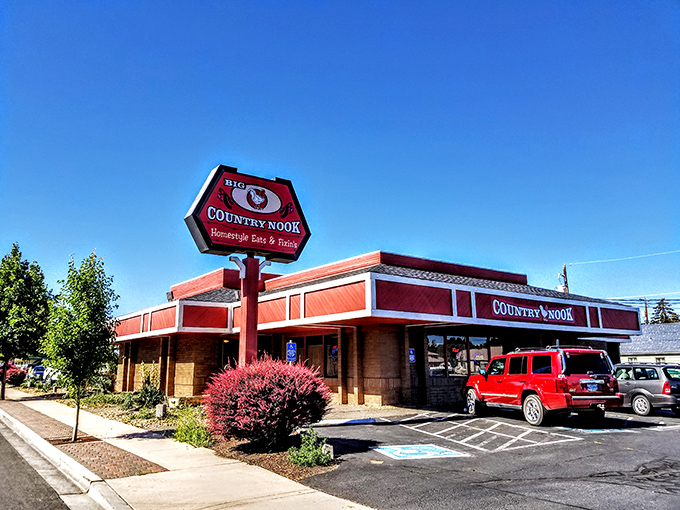 The iconic red-trimmed exterior of Big O Country Nook stands like a beacon for hungry travelers, promising comfort food salvation in Redmond's bustling landscape. 