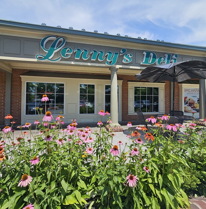 The teal script of Lenny's Deli against brick and cream siding isn't just signage&mdash;it's a promise of comfort food that transcends trends and satisfies souls.