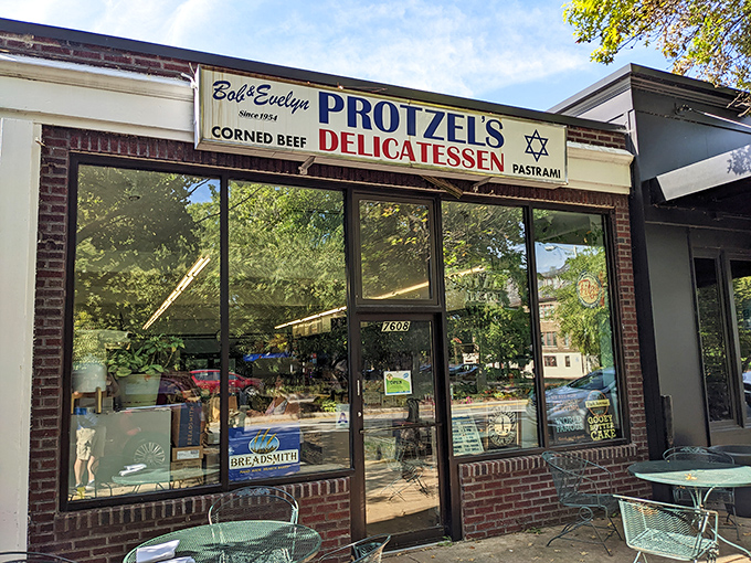The unassuming storefront of Protzel's Delicatessen stands like a time portal to sandwich nirvana, complete with outdoor seating for those perfect St. Louis afternoons.