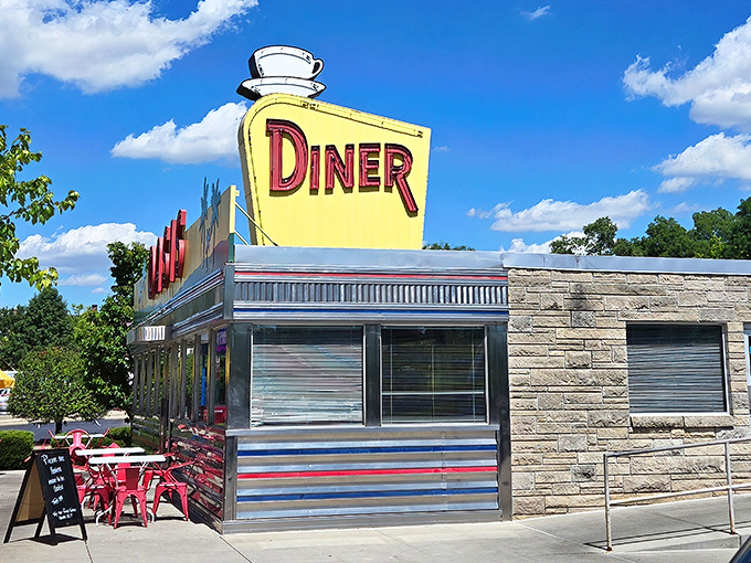 The sunshine-yellow facade of Oasis Diner gleams like a beacon of hope for hungry travelers. This isn't just a restaurant&mdash;it's a time machine with french fries.