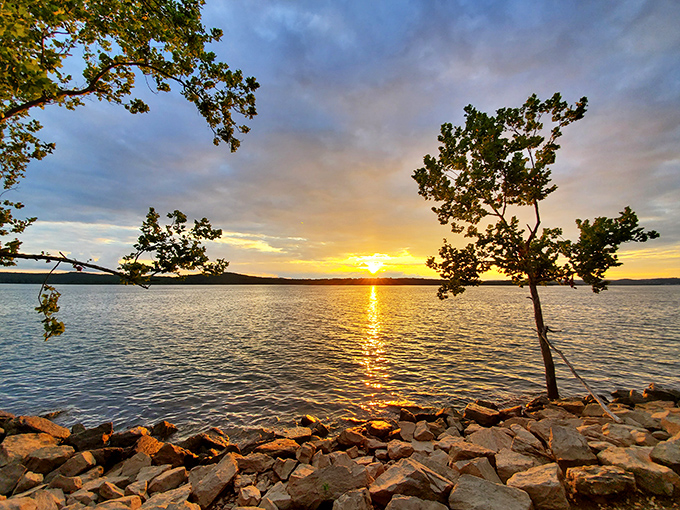Nature's perfect balance of accessibility and beauty. A paved pathway curves gently alongside the crystalline waters of Table Rock Lake, inviting explorers of all abilities. 