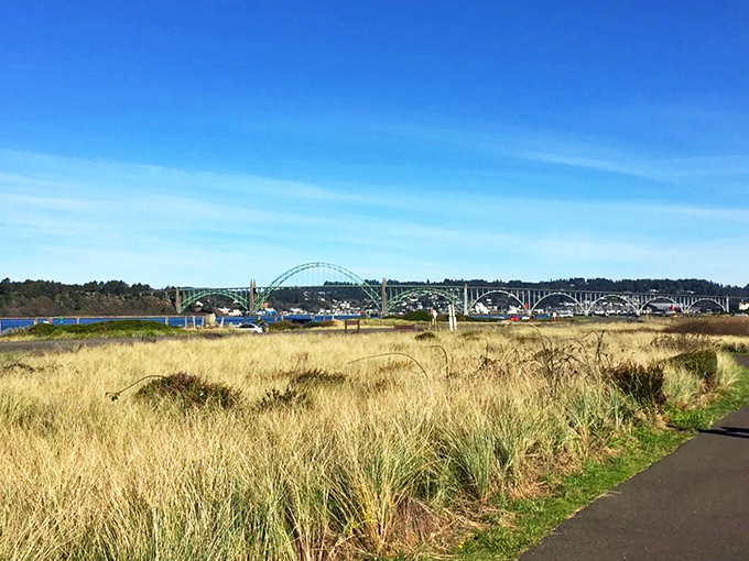 The welcoming sign at South Jetty offers more than directions&mdash;it's your first taste of adventure in this slice of Oregon Dunes National Recreation Area paradise. 