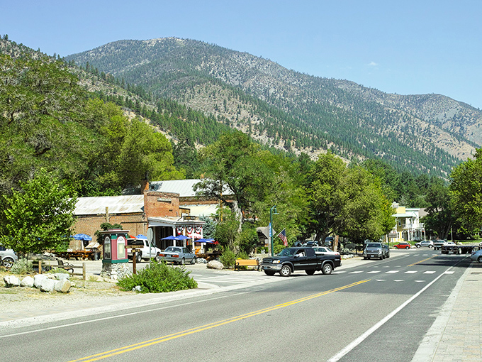 Genoa's main street offers that perfect small-town tableau – historic buildings nestled against mountains so majestic they look like they're showing off.